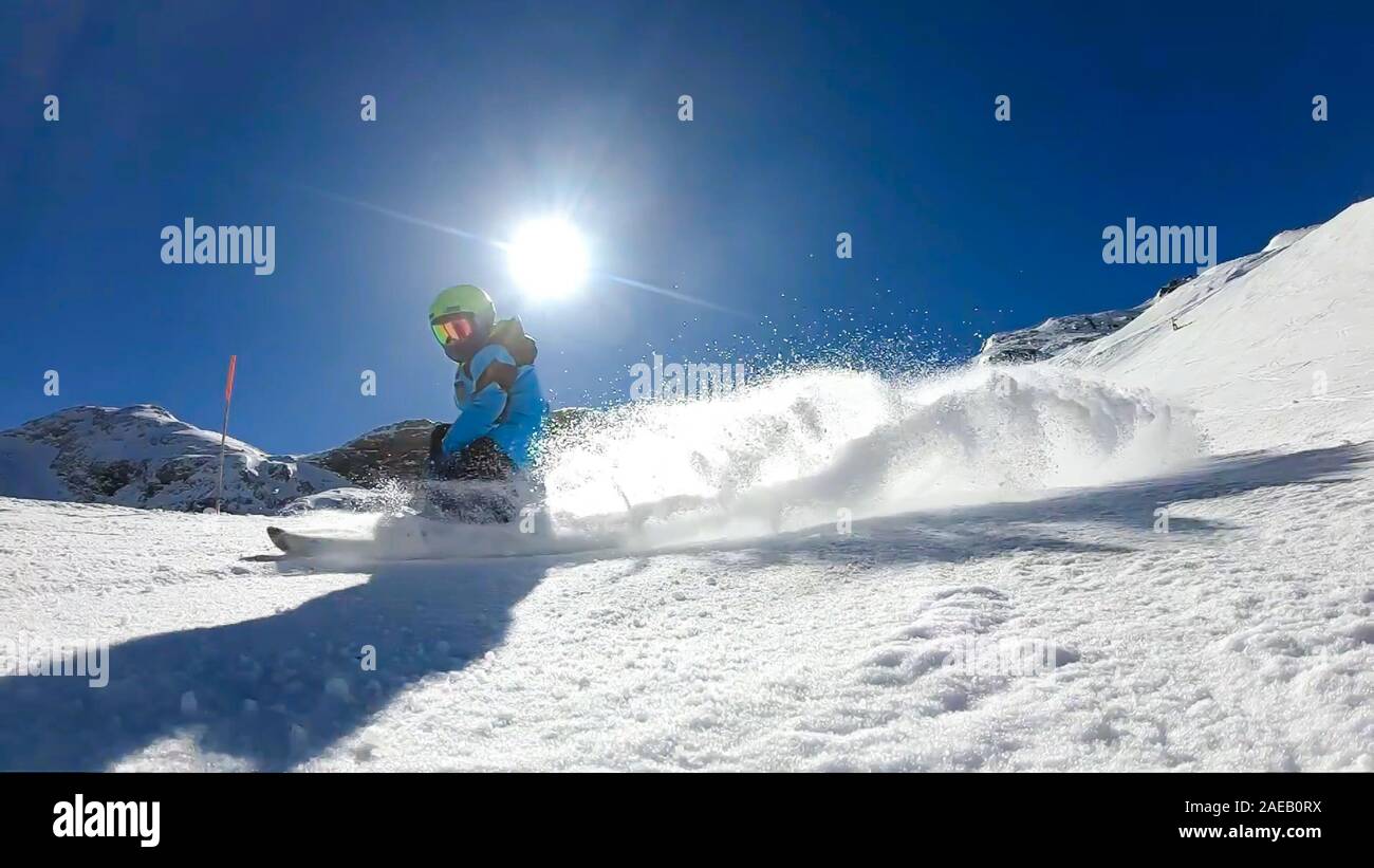 Little boy skiing. A 6 year old child enjoys a winter holiday in the ...