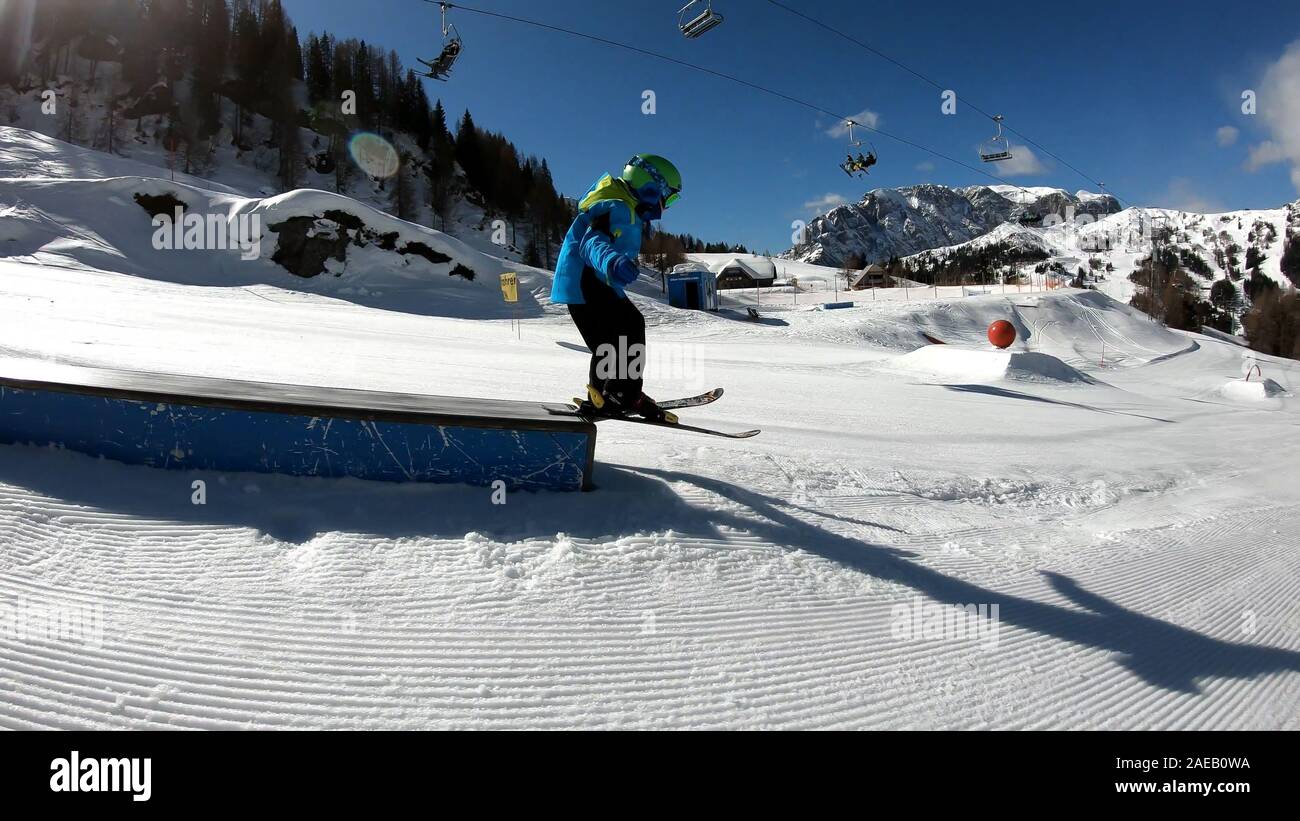 Little boy skiing. A 6 year old child enjoys a winter holiday in the ...