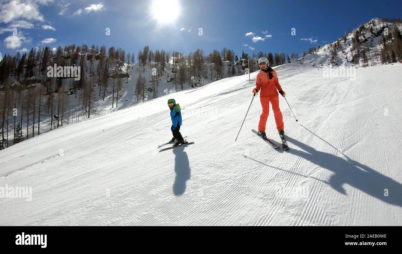 Little boy skiing in the Alpine resort. A 6 year old child enjoys a ...