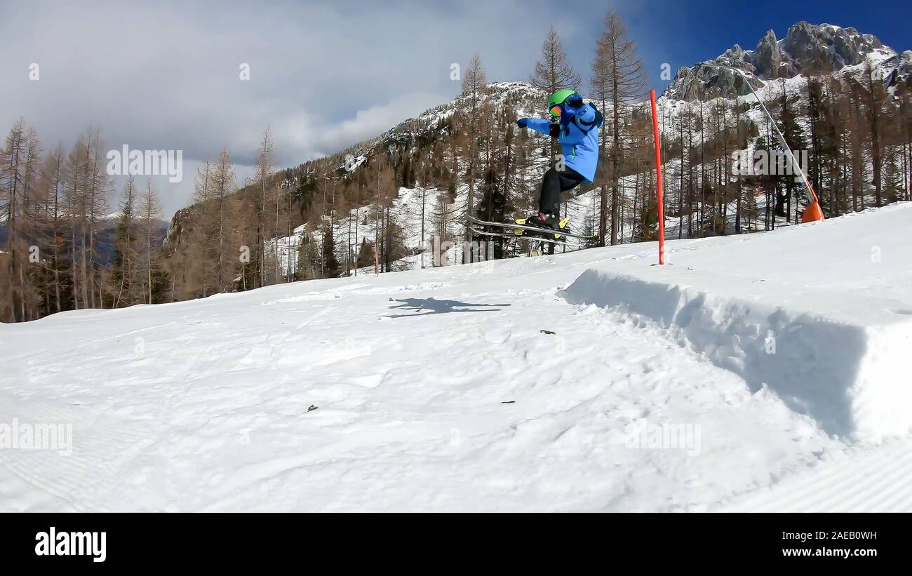 Little boy skiing. A 6 year old child enjoys a winter holiday in the ...