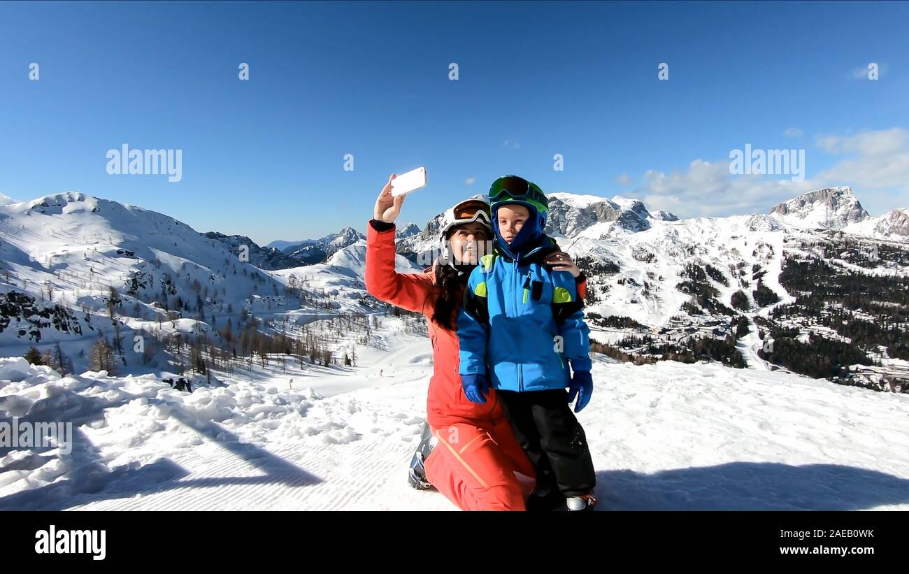 Little boy skiing in the Alpine resort. A 6 year old child enjoys a ...