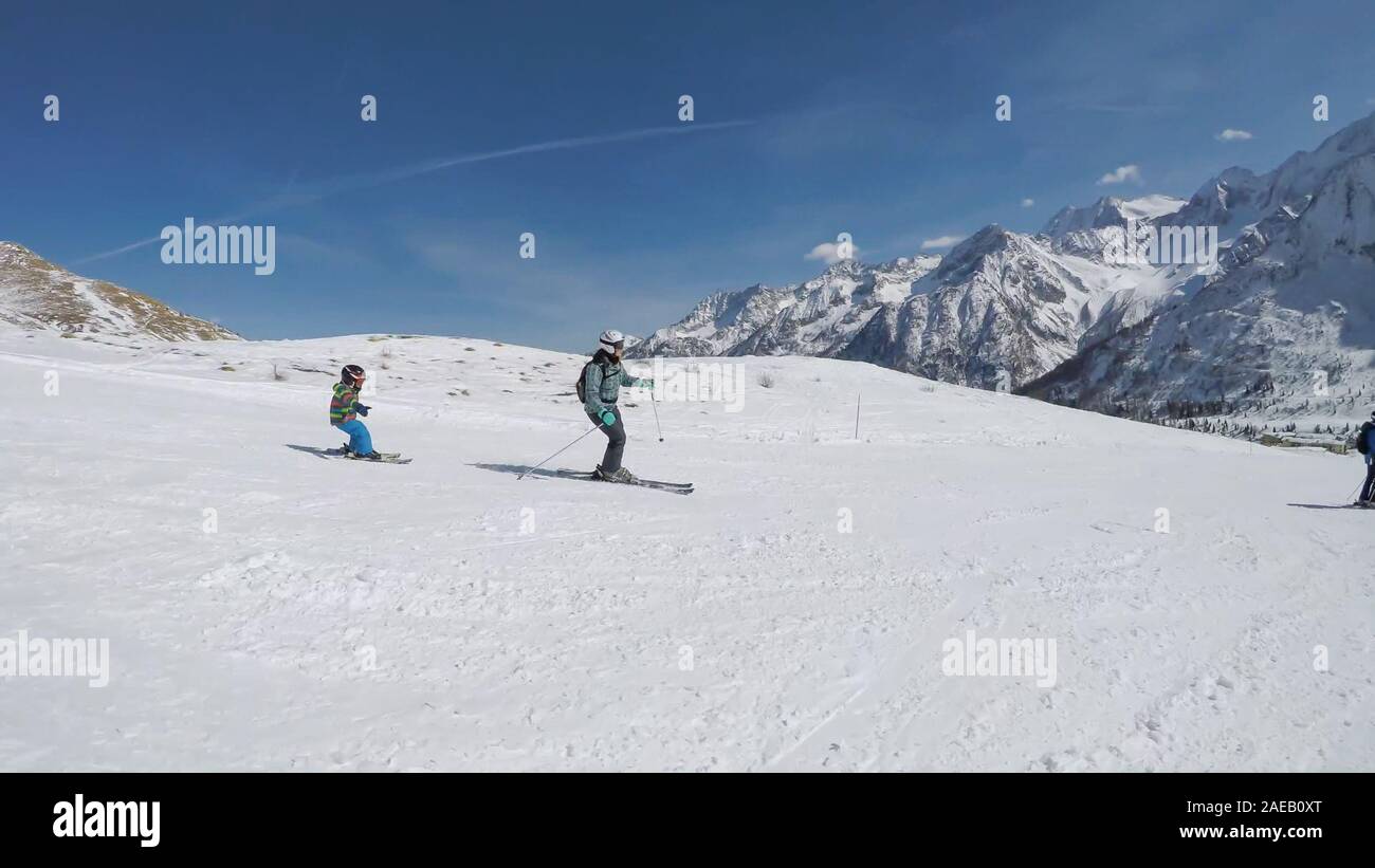 Little boy skiing in the Alpine resort. A 6 year old child enjoys a ...