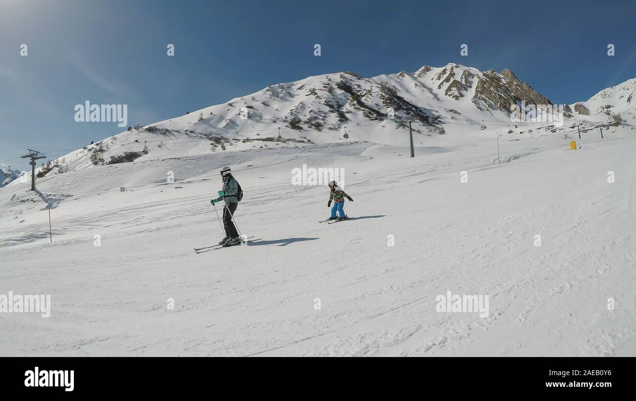 Little boy skiing in the Alpine resort. A 6 year old child enjoys a ...
