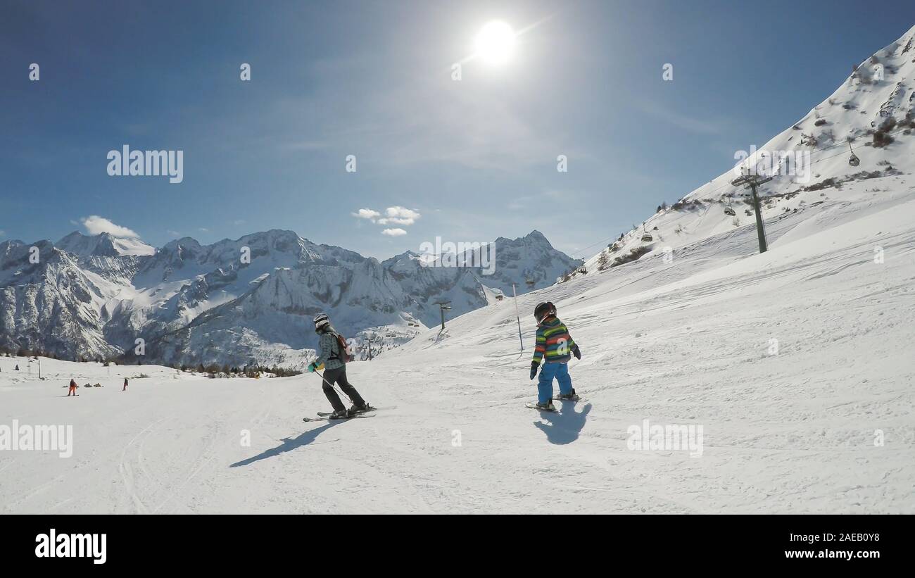 Little boy skiing in the Alpine resort. A 6 year old child enjoys a ...
