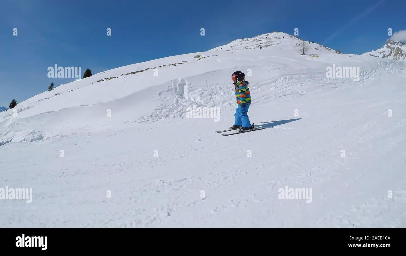 Little boy skiing. A 6 year old child enjoys a winter holiday in the ...