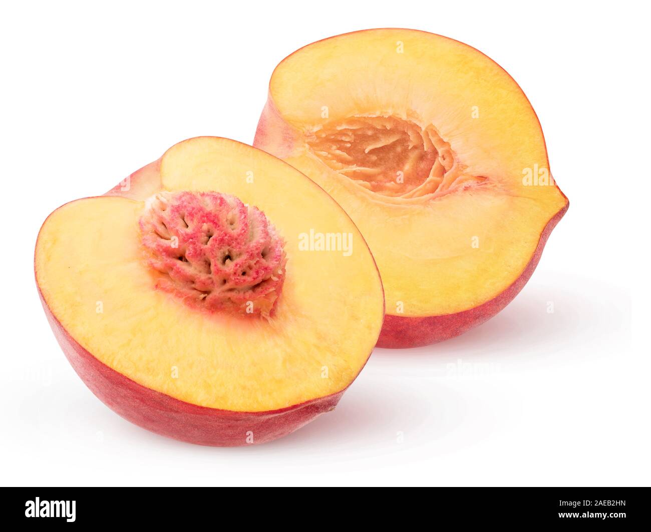 Isolated peaches. One peach fruit cut into halves isolated on white ...