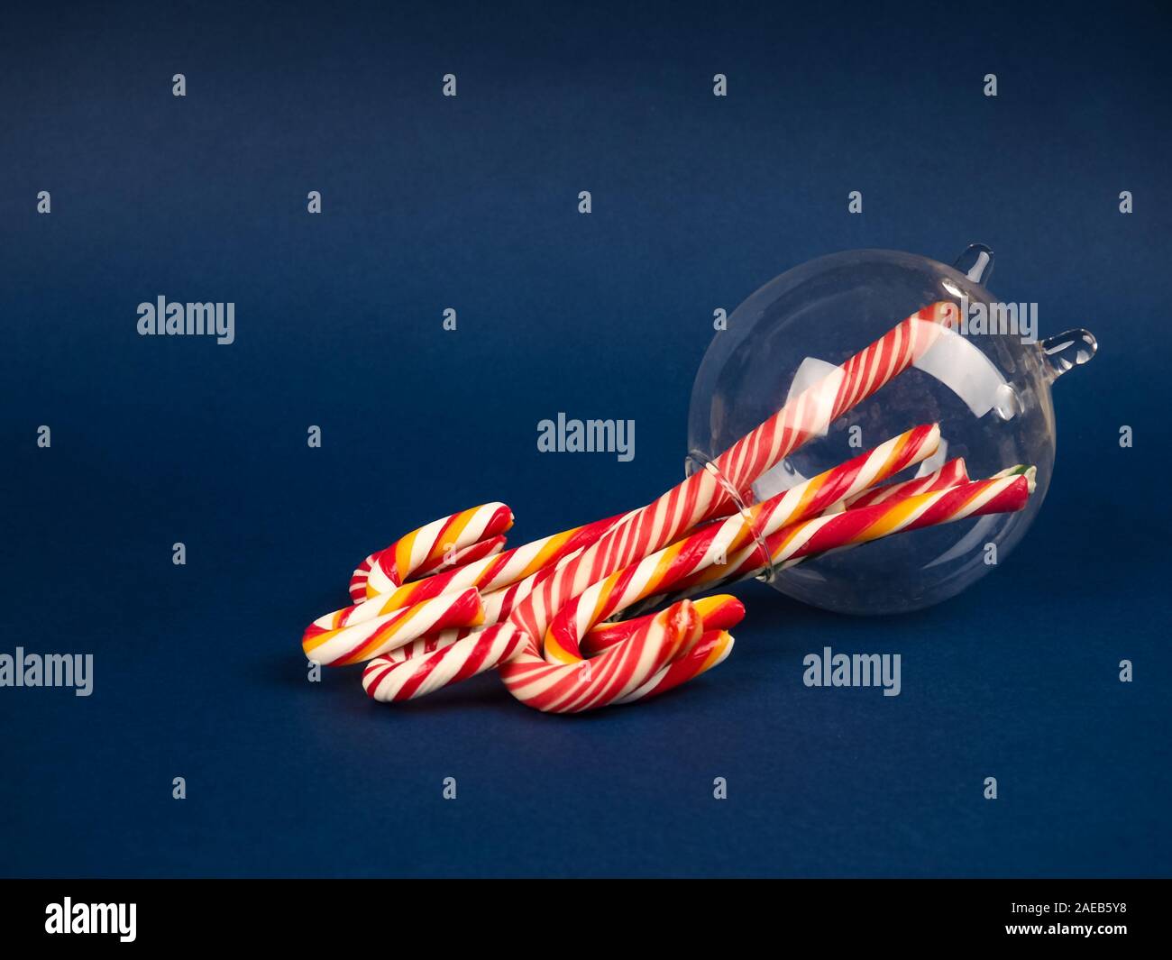 Christmas candy cane. On classic blue background. Flat lay and top view ...