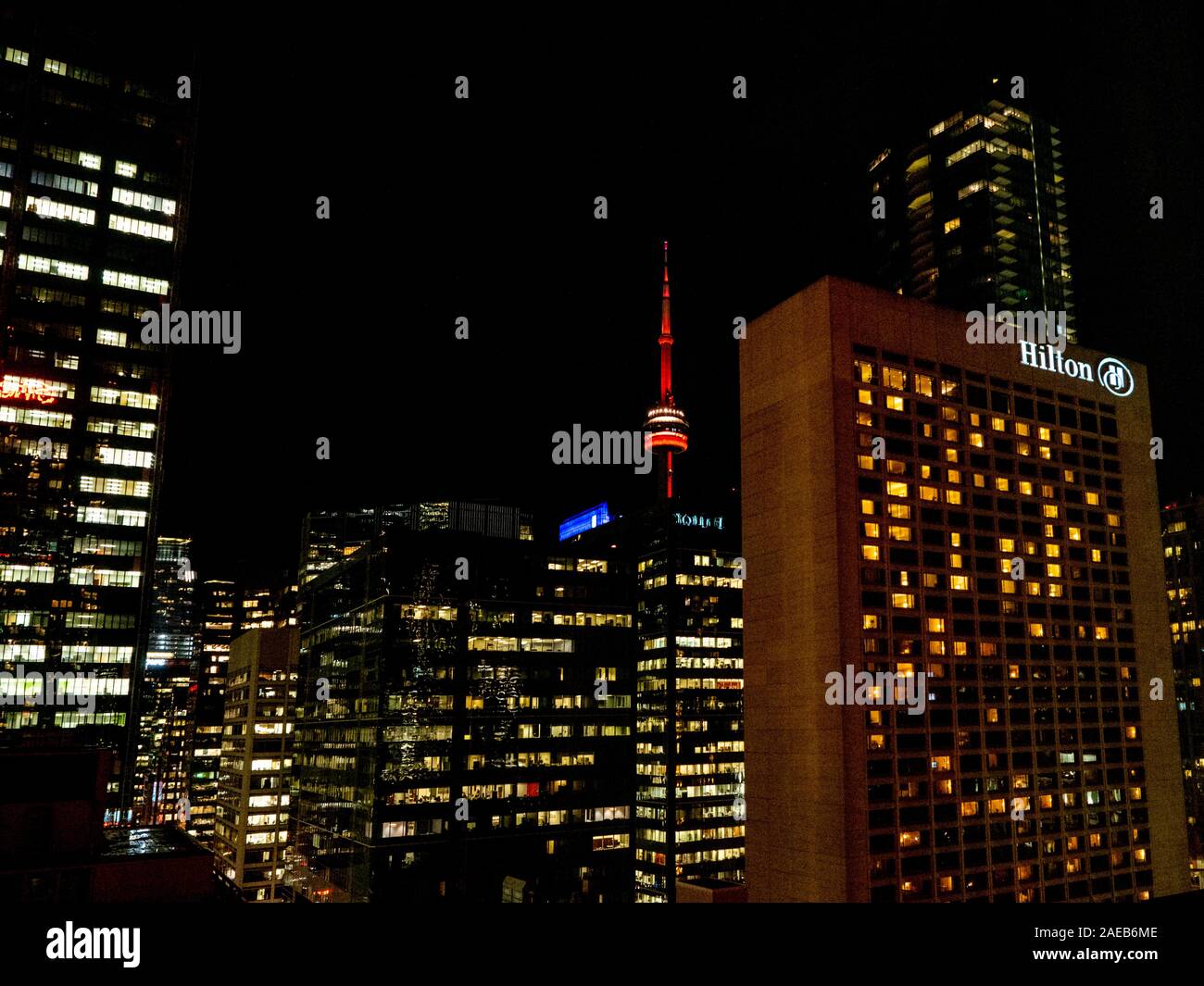 CN Tower and Hilton hotel at night in the city of Toronto, Ontario ...