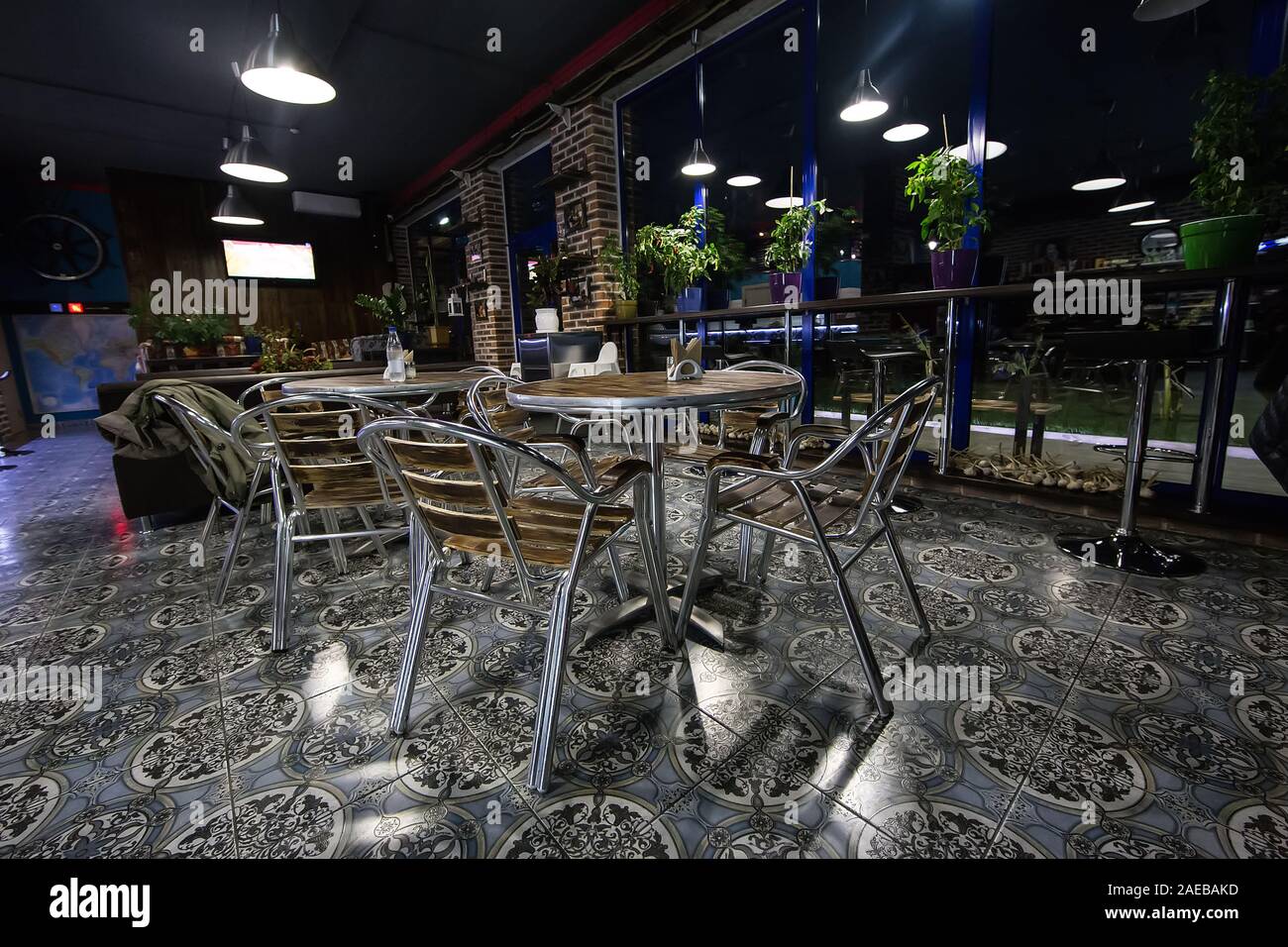 interior cafe with metal chairs and tables Stock Photo - Alamy