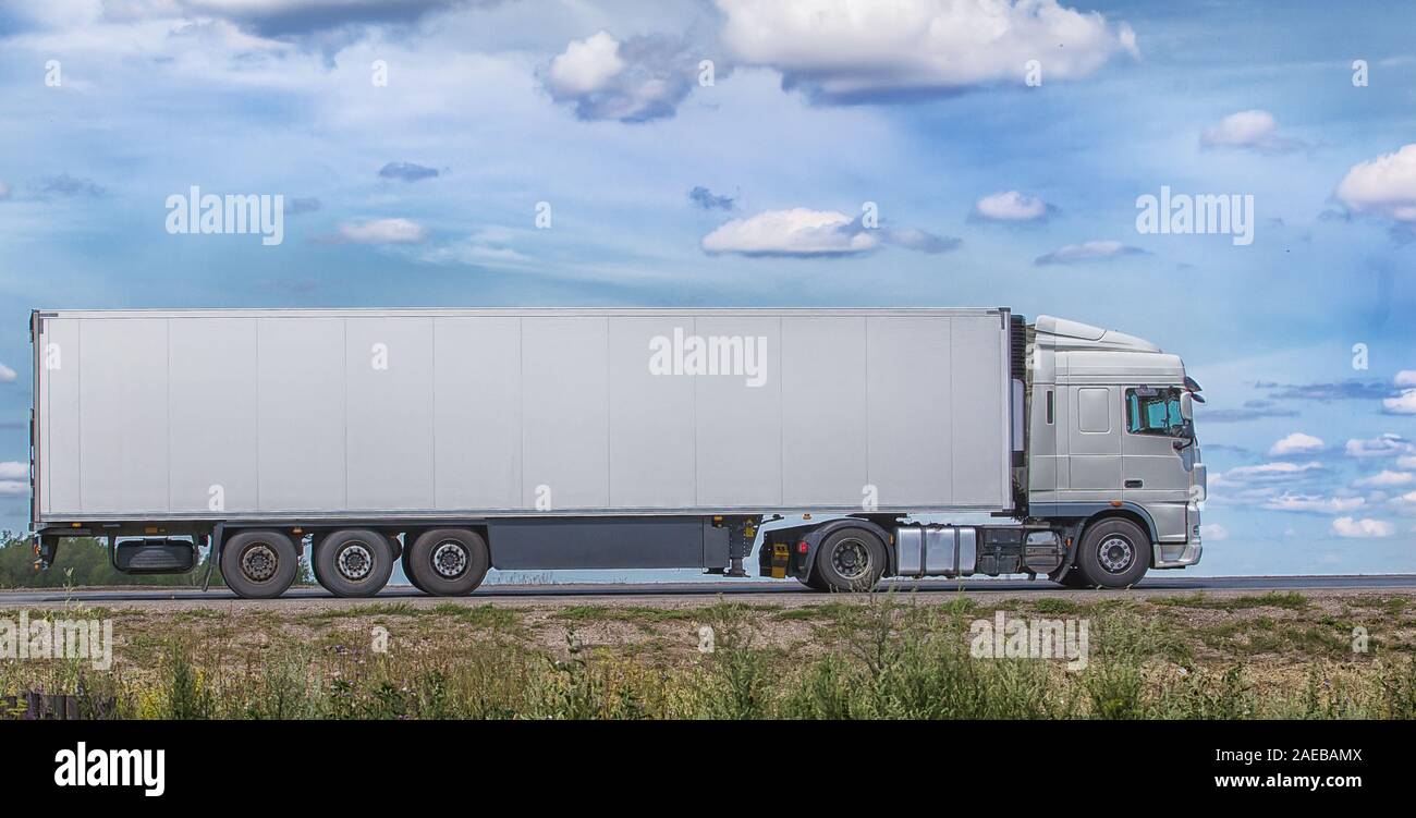 white truck transports freight on the country highway Stock Photo - Alamy