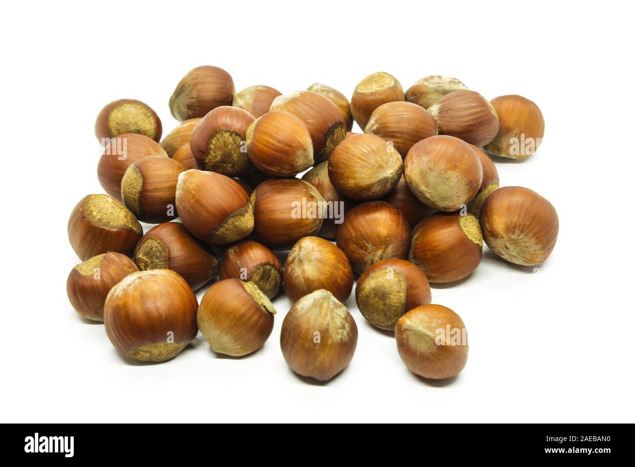Handful hazelnut nuts isolated on white background Stock Photo - Alamy