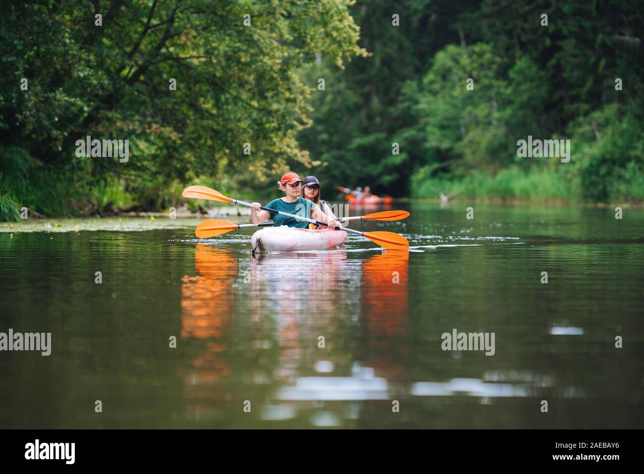 Kayaking with family and friends on river Stock Photo - Alamy