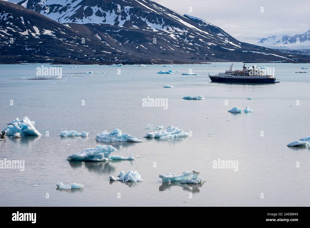 A cruise ship in the Arctic sea ice in Svalbard, Norway in July Stock ...