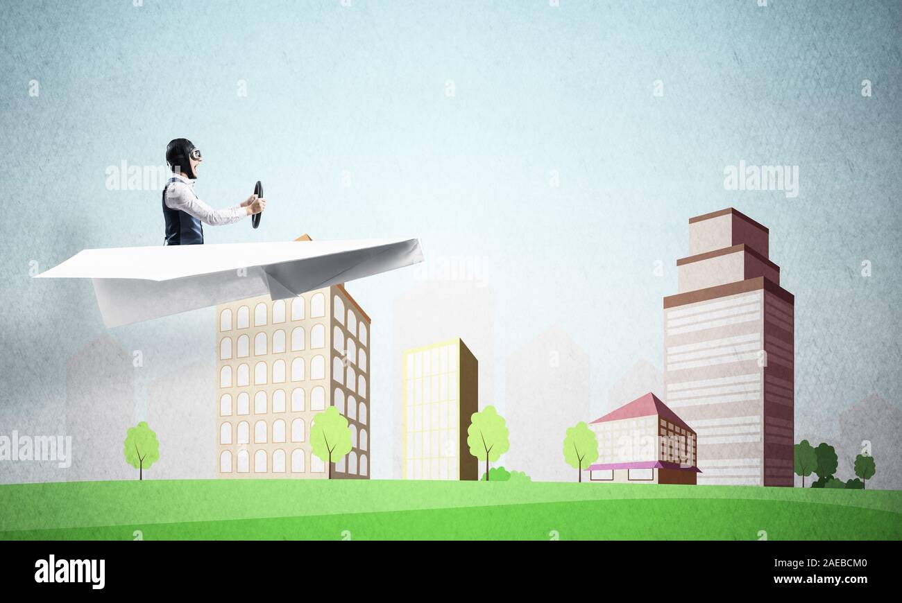Aircraft pilot flying in paper plane Stock Photo - Alamy
