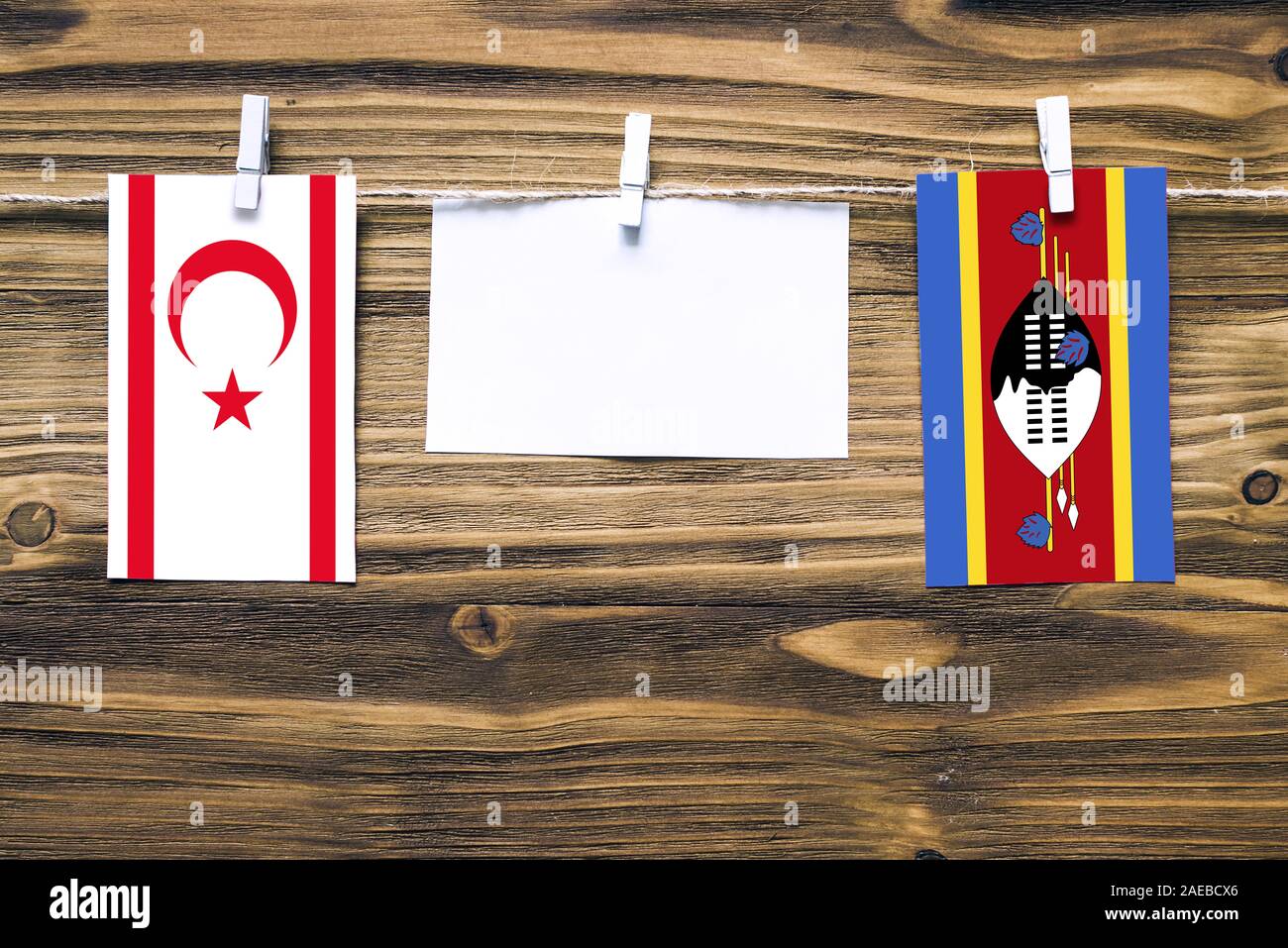 Hanging flags of Northern Cyprus and Swaziland attached to rope with ...