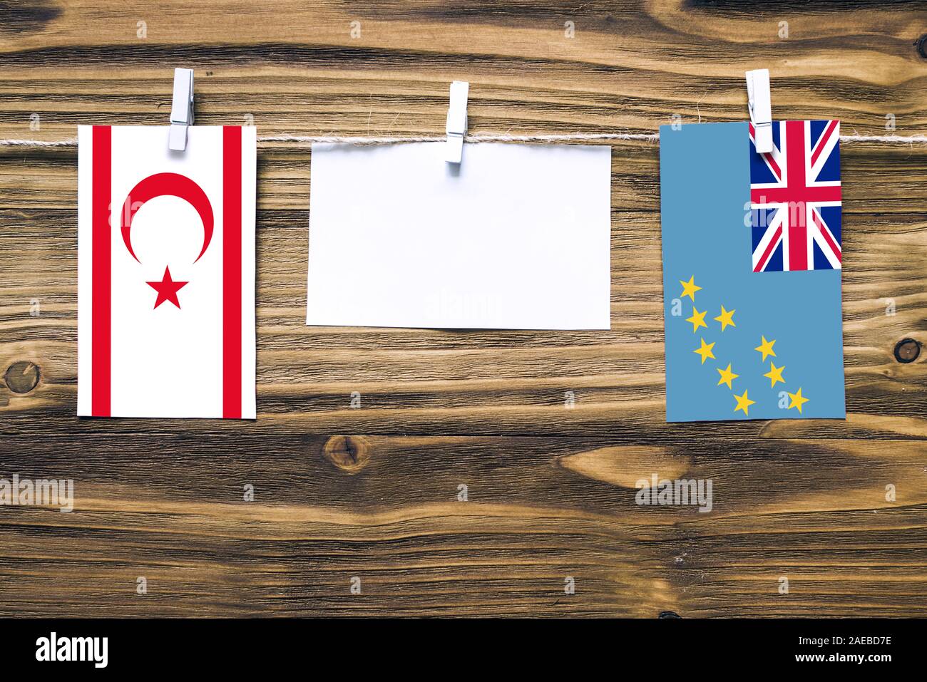 Hanging flags of Northern Cyprus and Tuvalu attached to rope with ...