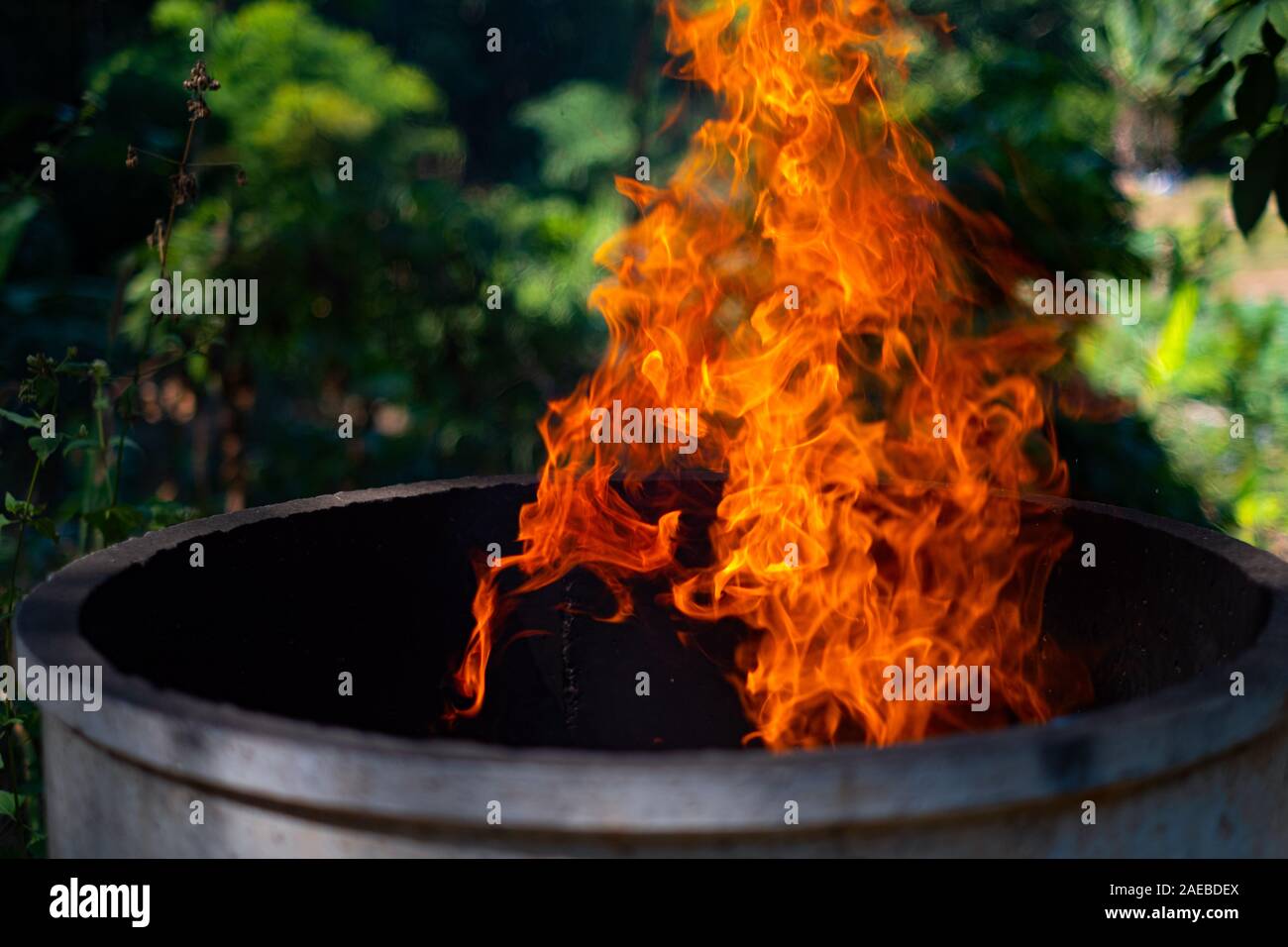 Cement tank at fire flames on blurred background, Burning red hot ...