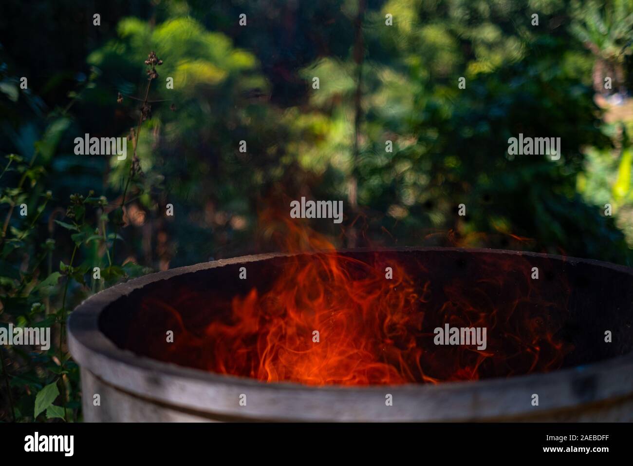 Cement tank at fire flames on blurred background, Burning red hot ...