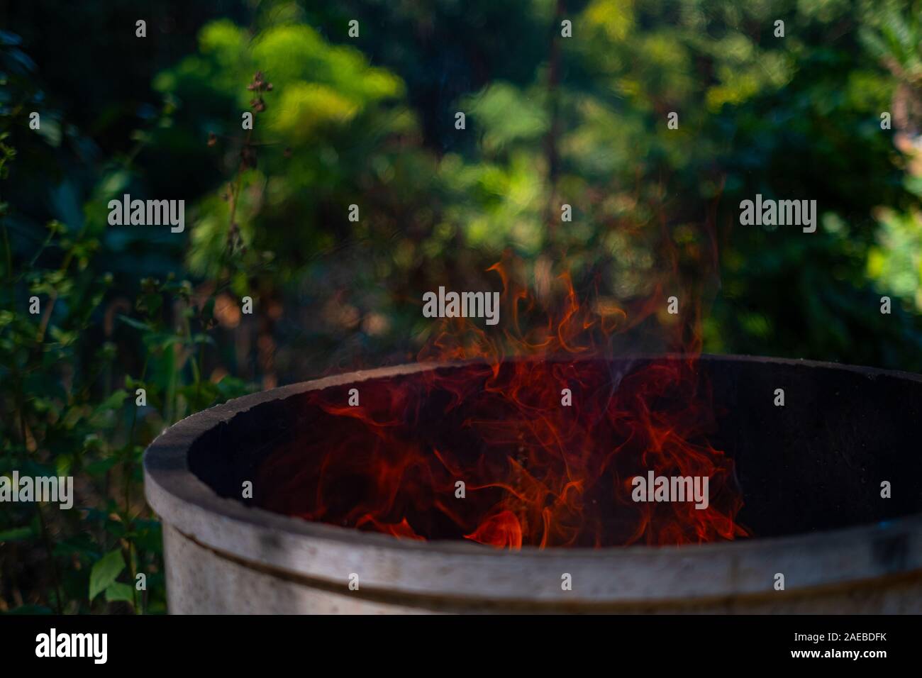 Cement tank at fire flames on blurred background, Burning red hot ...