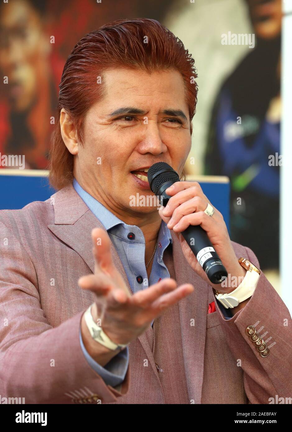 Saitama, Japan. 8th Dec, 2019. Japanese actor Riki Takeuchi holds a ...