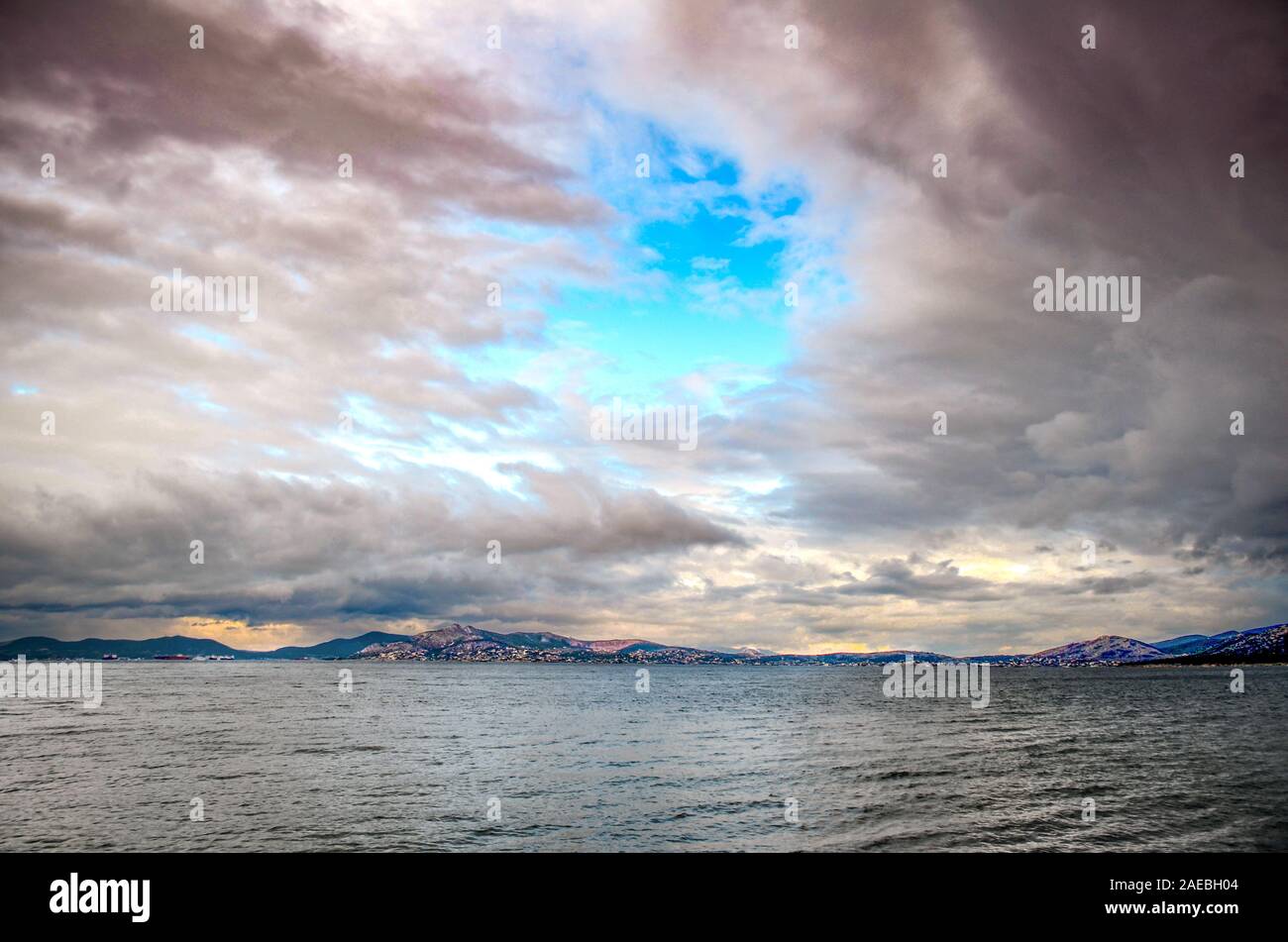 Dramatic sky over Pachi, A fishing village in Saronic gulf,Greece Stock ...