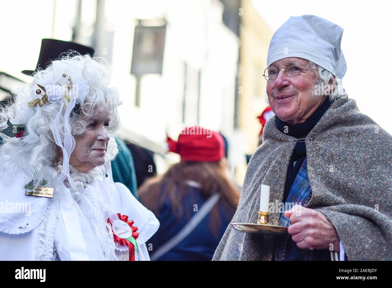 Rochester, UK. 8 December 2019. Participants dressed as (L to R) The ...