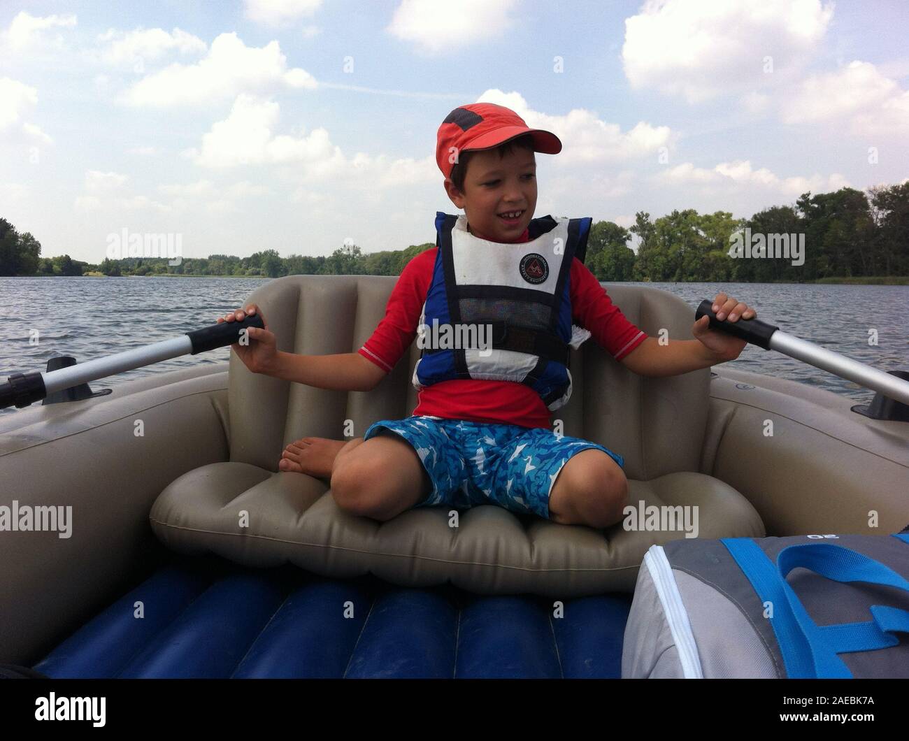 Boy on a rubber boat, happy childhood, relax on a boat, polish rivers ...