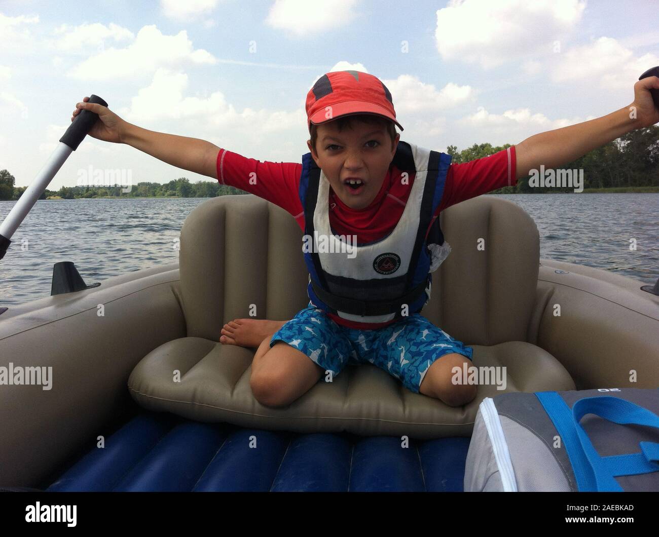 Boy on a rubber boat, happy childhood, relax on a boat, polish rivers ...