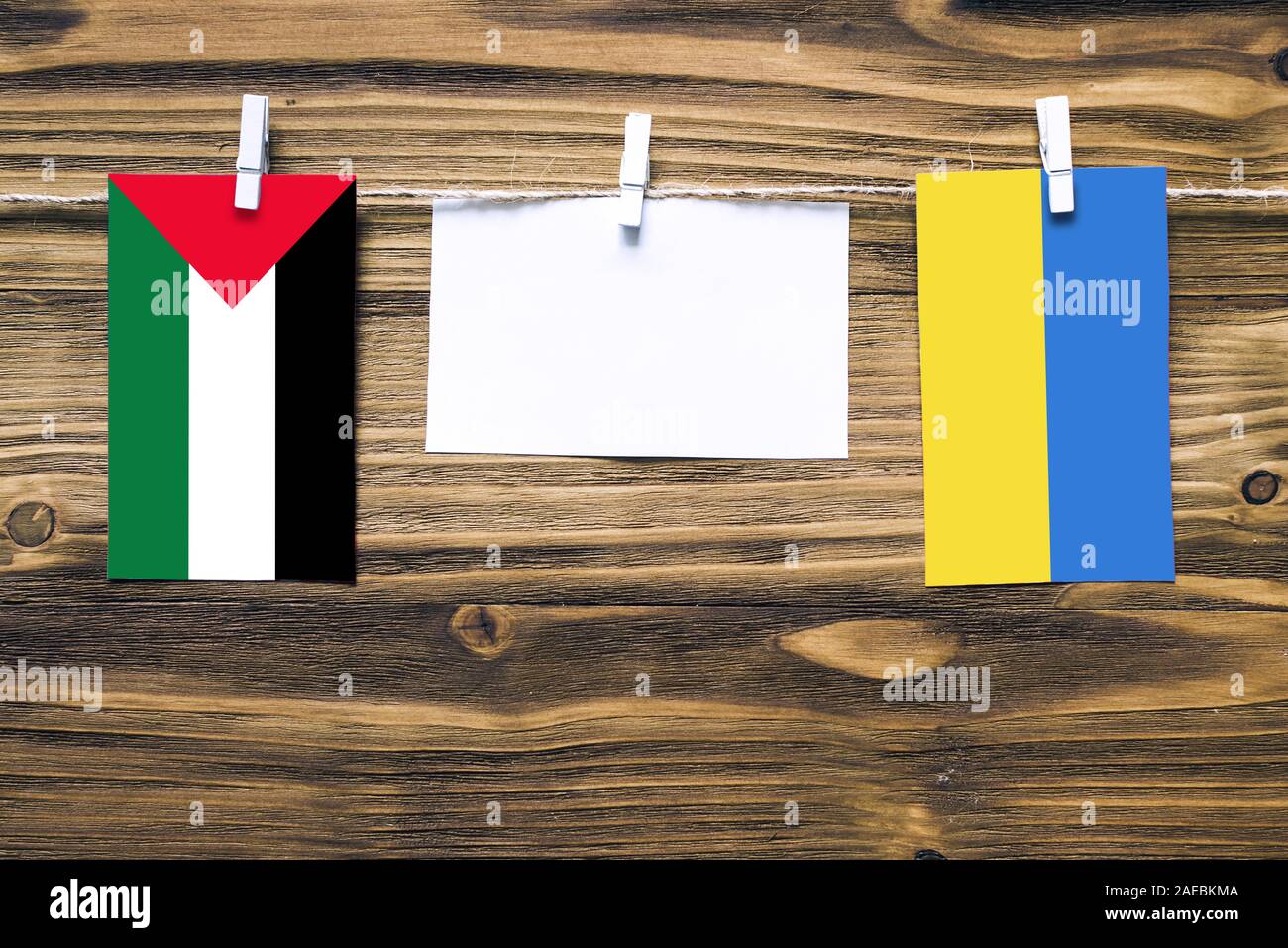 Hanging flags of Palestine and Ukraine attached to rope with clothes ...