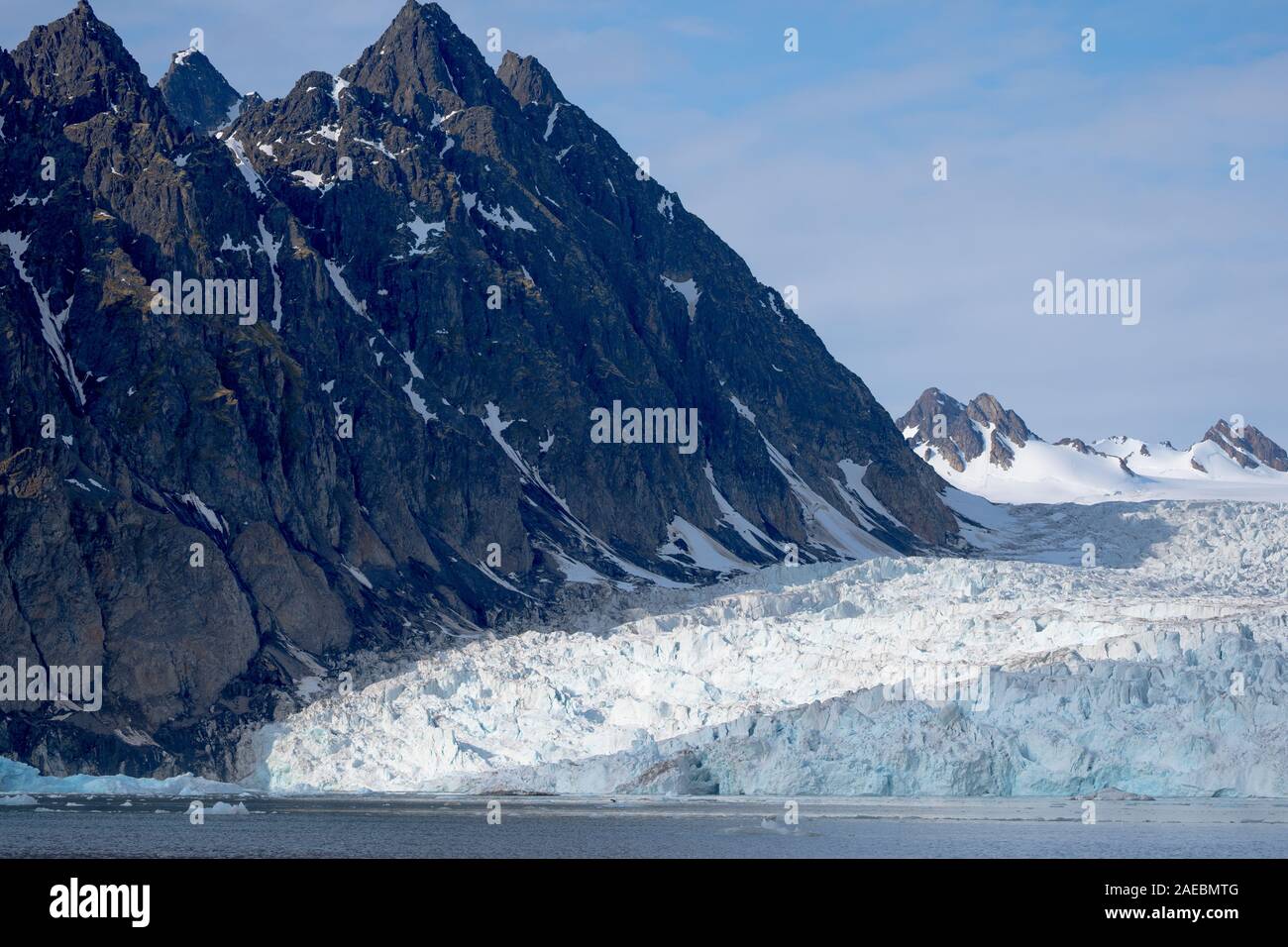Glacier alongside rocks in the North Sea of Norway Stock Photo - Alamy