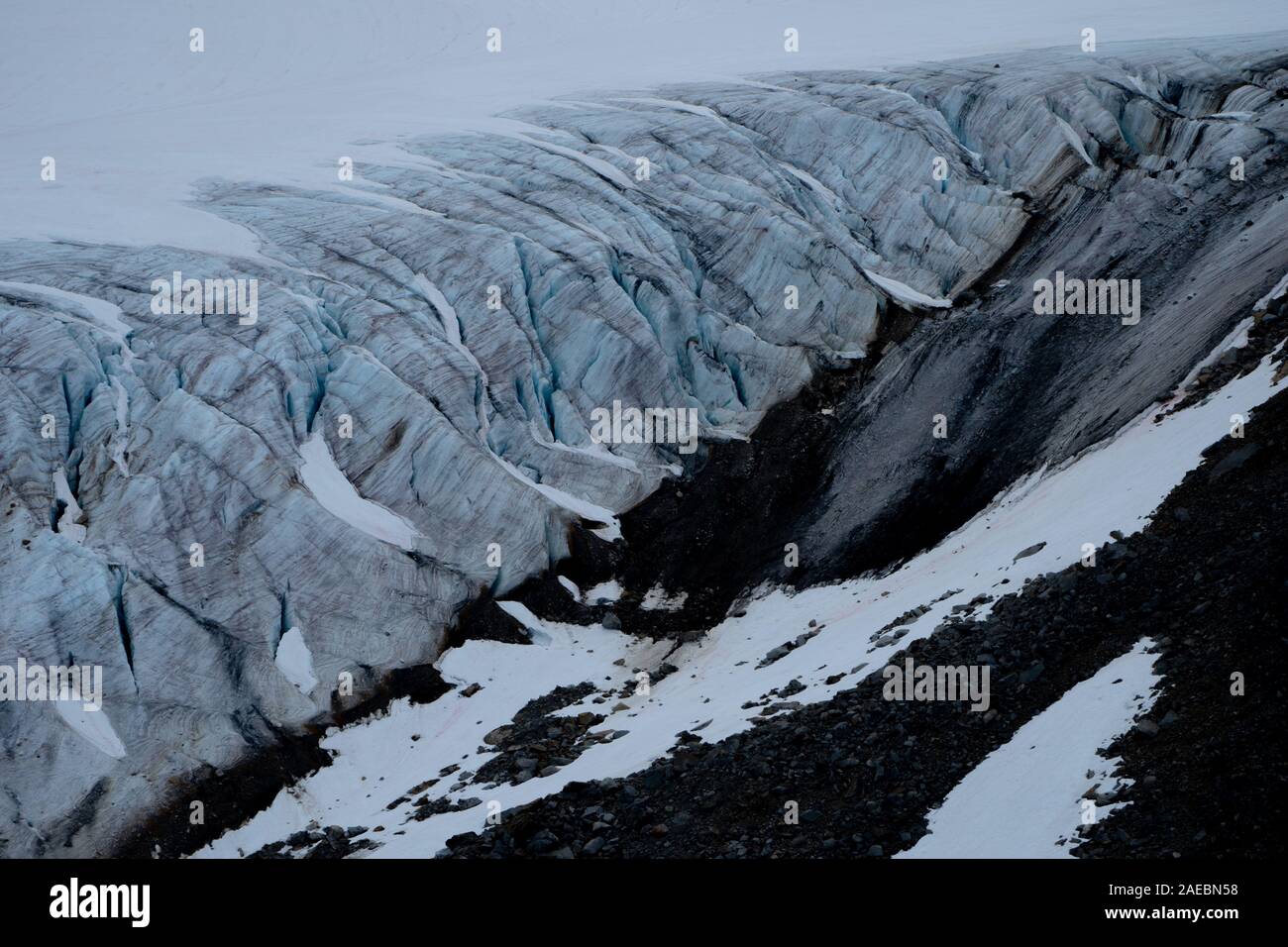 Glacier alongside rocks in the North Sea of Norway Stock Photo - Alamy