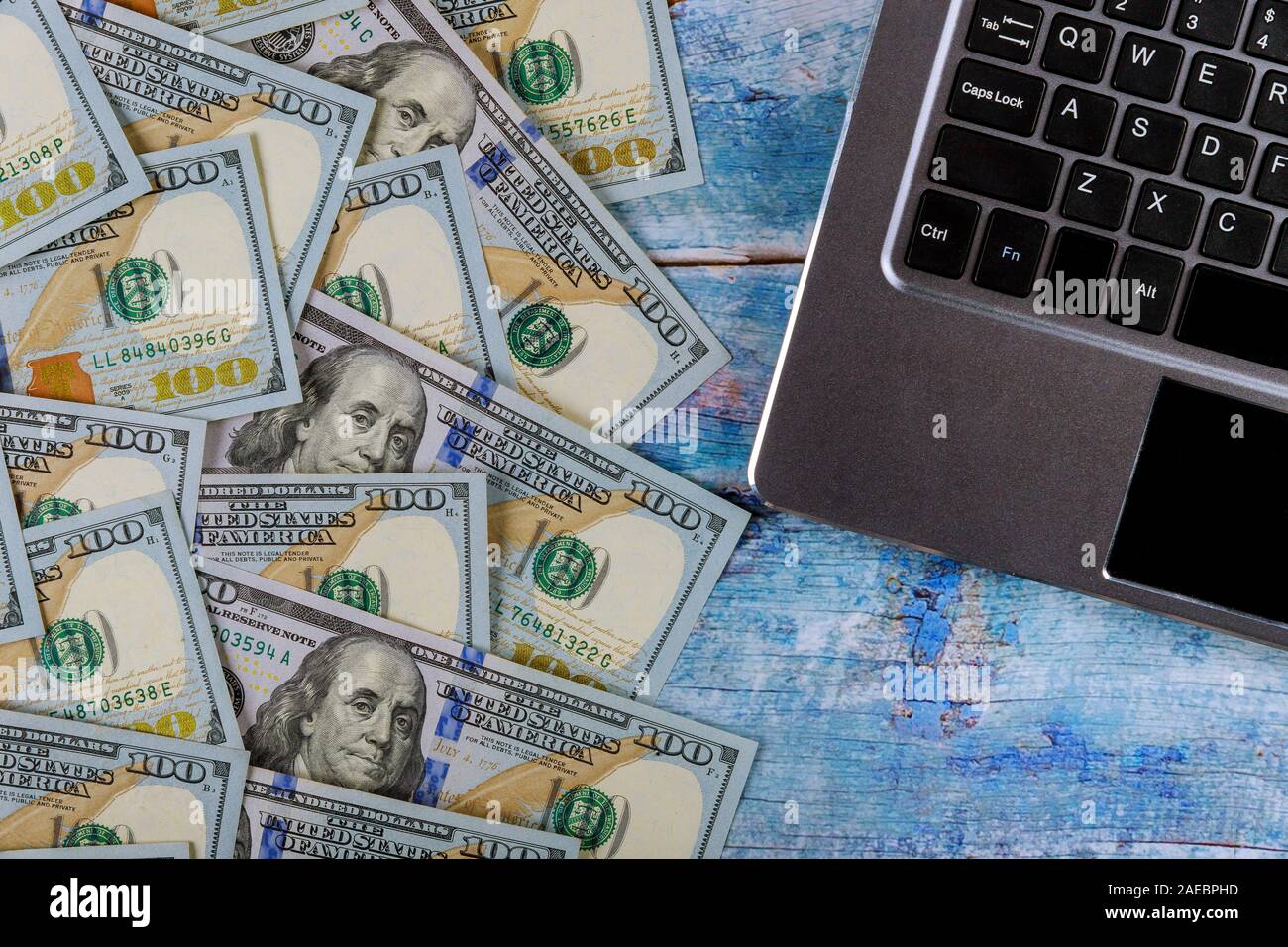 Paper money 100 dollar bills on laptop modern computer keyboard ...