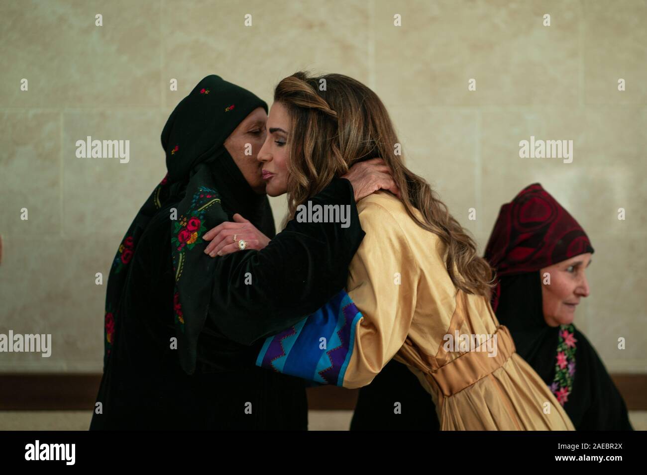Queen Rania with members of the Al Da’aja tribe in Amman, on December ...