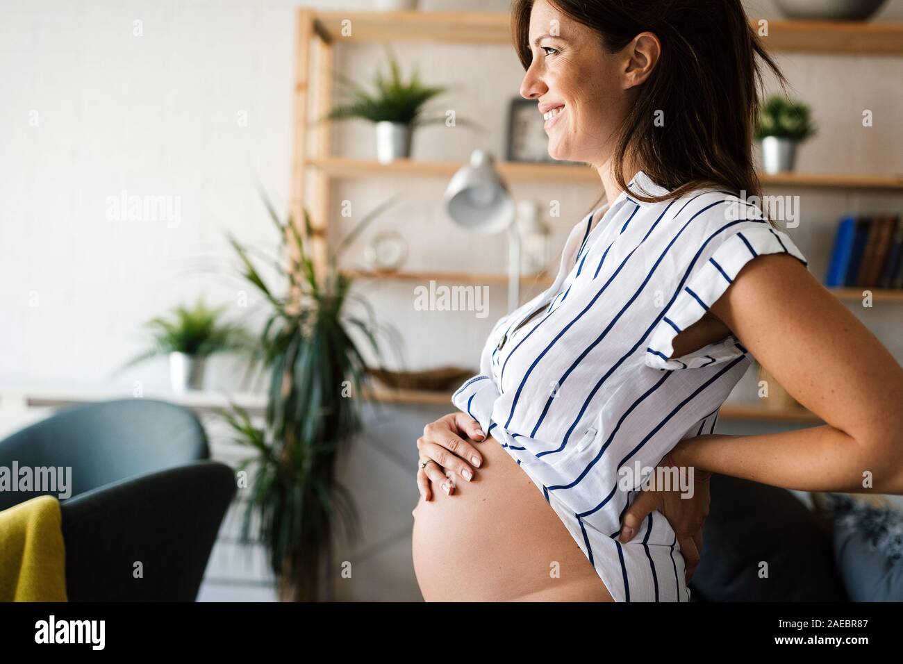 Beautiful pregnant woman expecting baby. Maternity concept Stock Photo ...