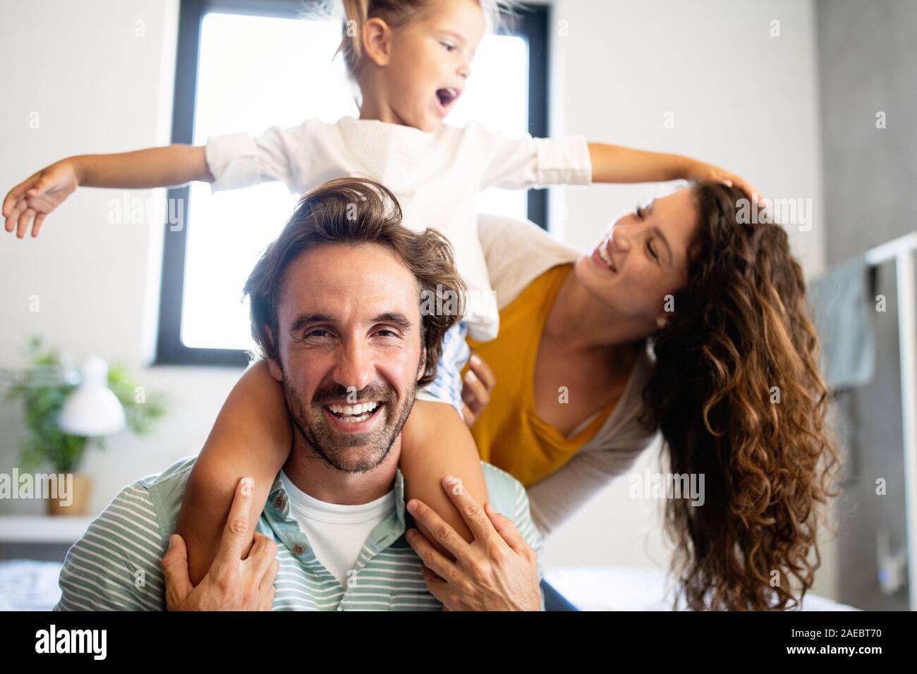 Happy family having fun time at home Stock Photo - Alamy