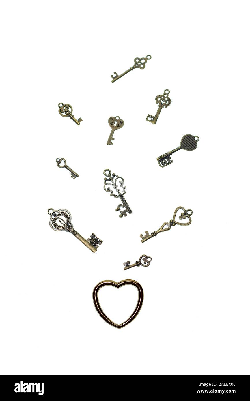 Vintage skeleton keys with metall heart on white background Stock Photo ...