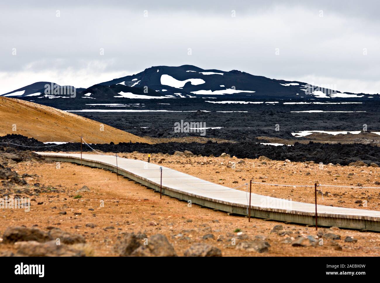 A path made of wood leading through the lava landscape of the ...