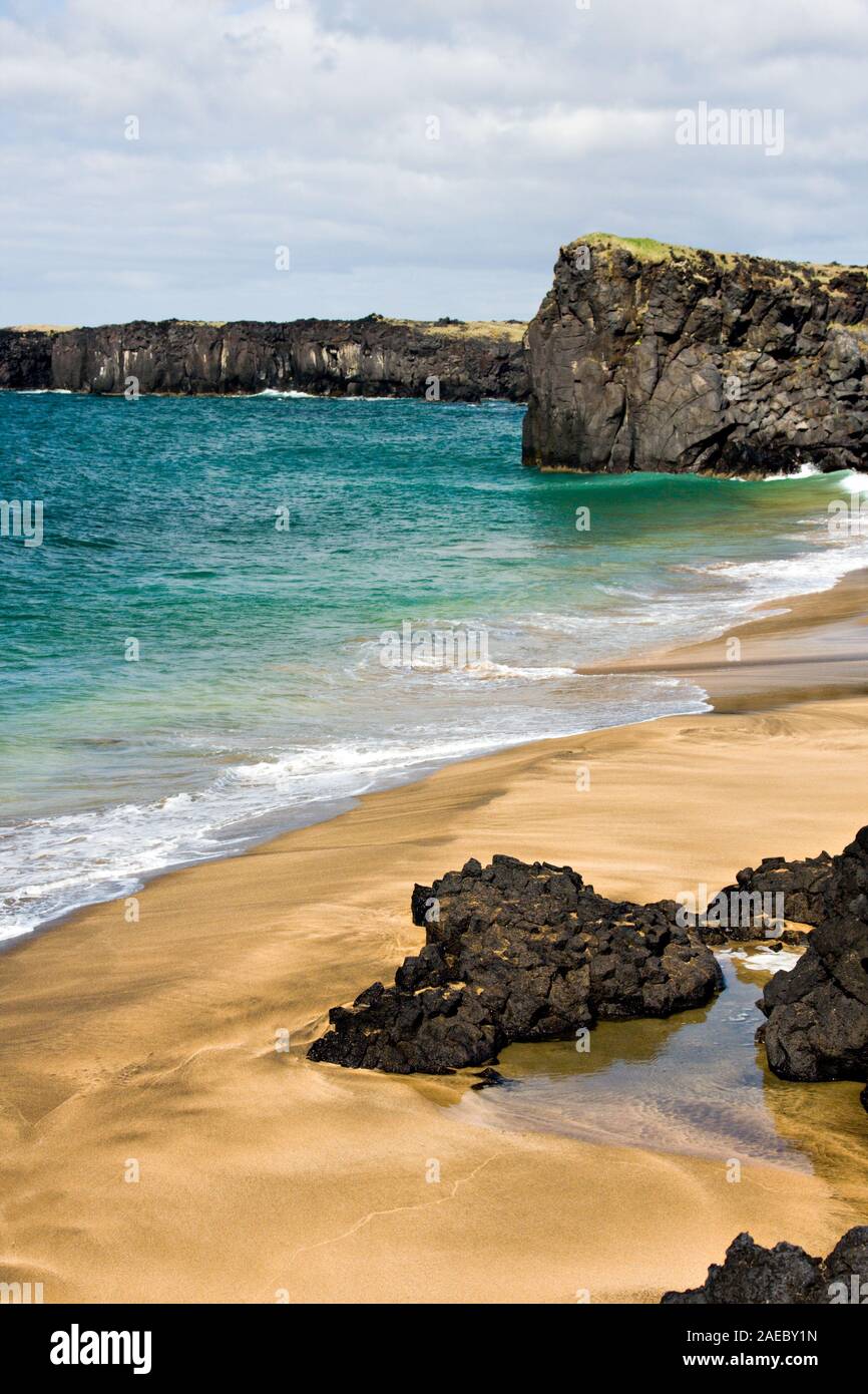 The golden beach of Skardsvìk in the west of the Snaefellsnes peninsula ...