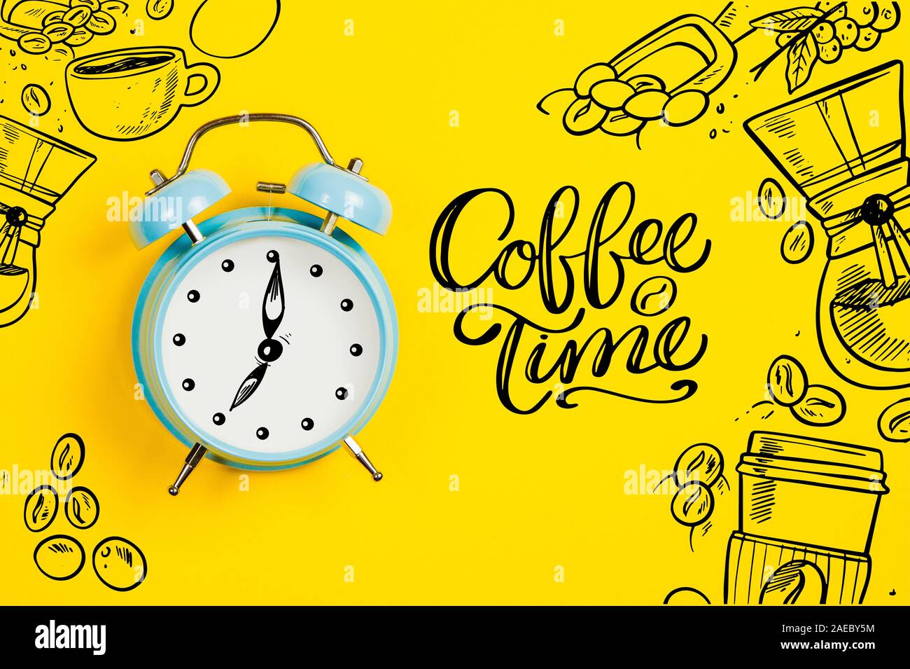 Blue alarm clock with graphics and text Coffee time on a yellow ...