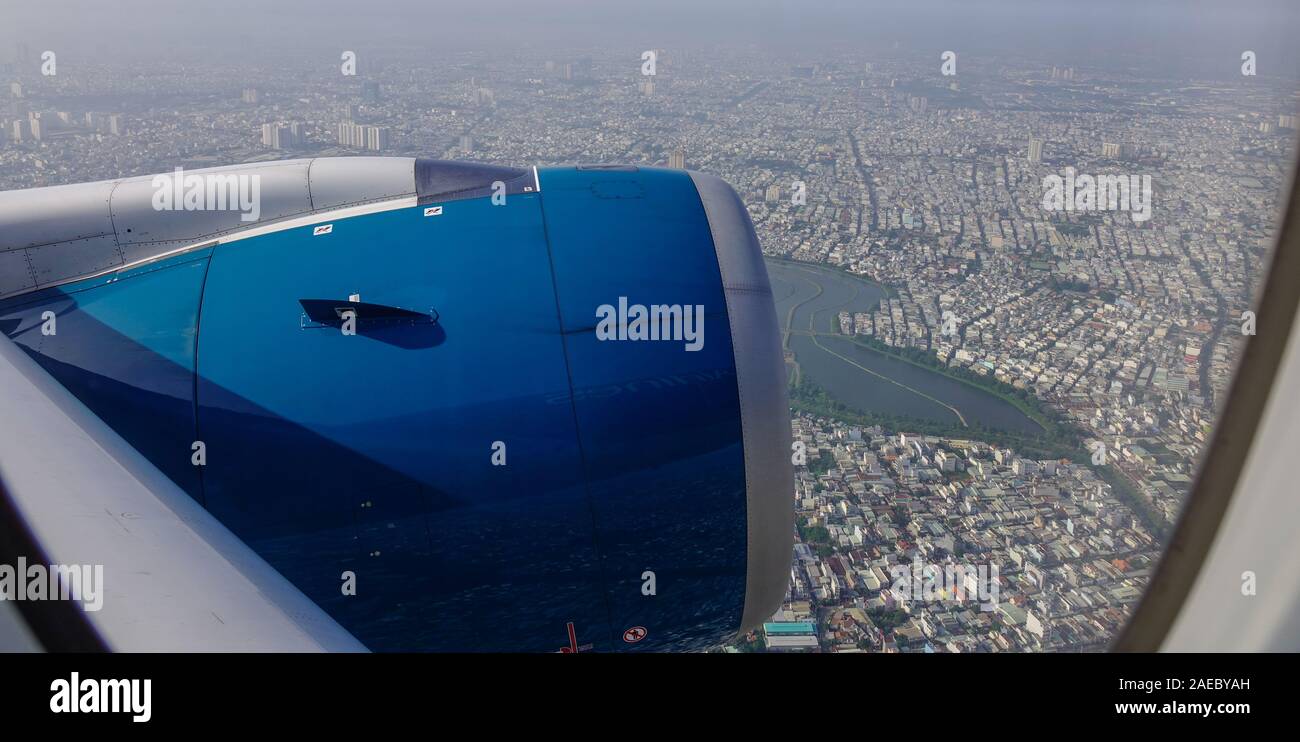 Blue engine of passenger airplane in the sky with cloudscape background ...