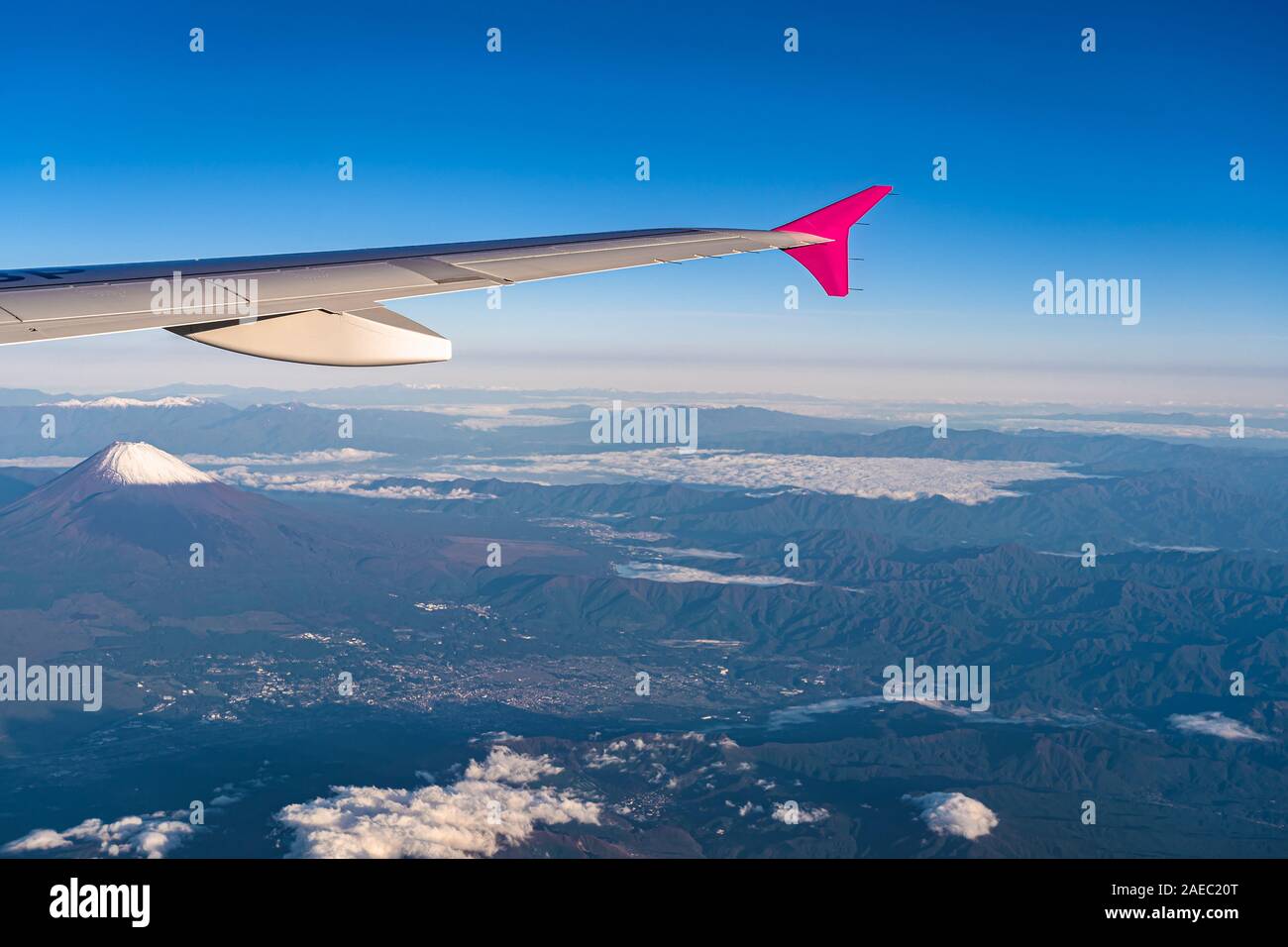 Aerial view of airplane wing with Mount Fuji ( Mt. Fuji ) in background ...