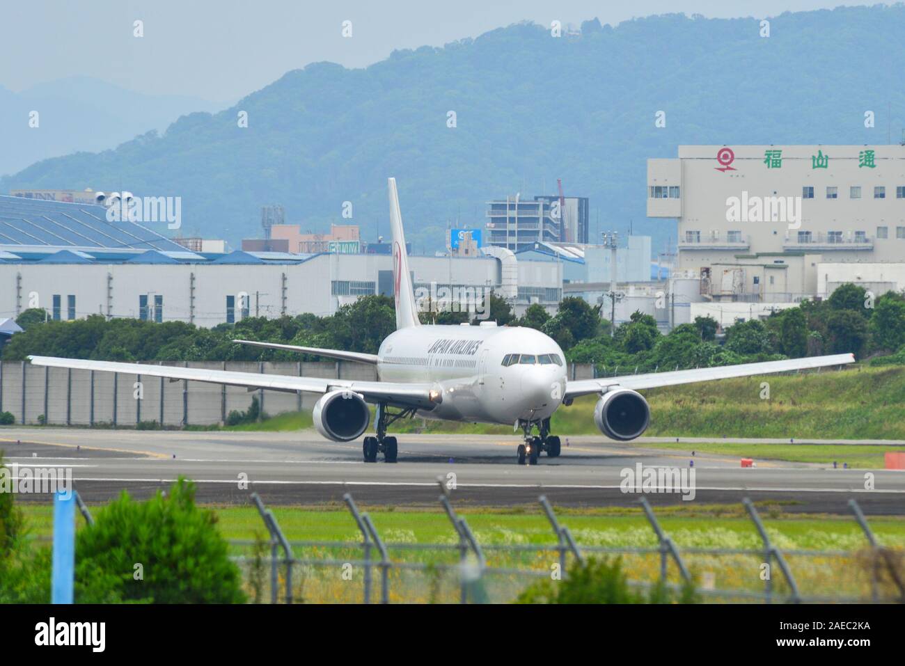 Osaka, Japan - Jun 26, 2019. JAL passenger airplane taxiing on runway ...