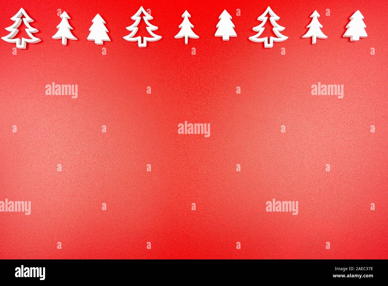 Wooden, white Christmas trees arranged in a row on top, isolated on a ...