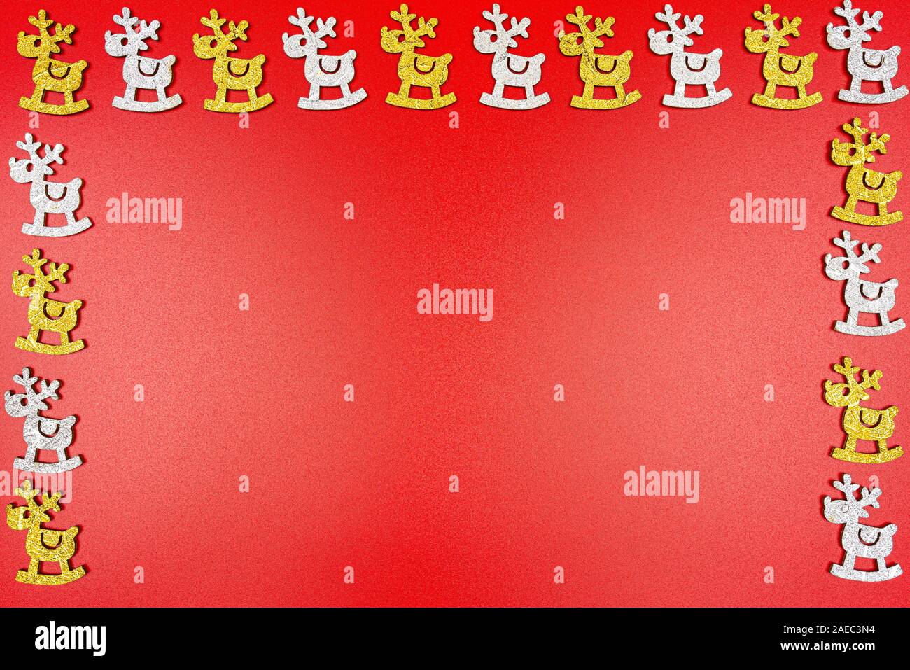 Background made of reindeer arranged in a row at the top and sides ...