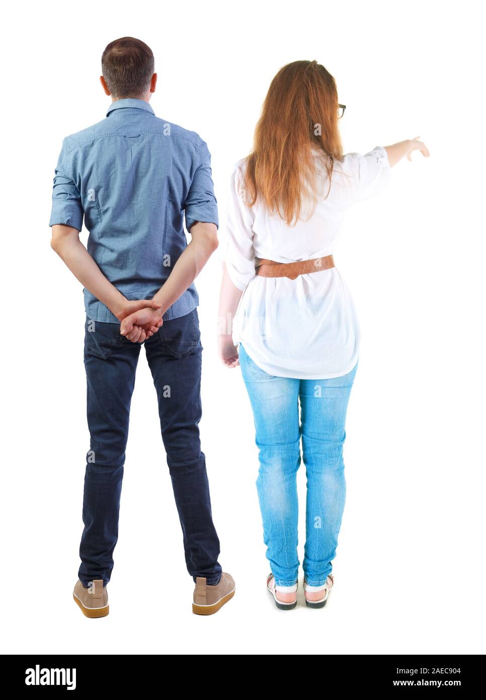 Back view of a stylish couple pointing. beautiful friendly girl and guy ...