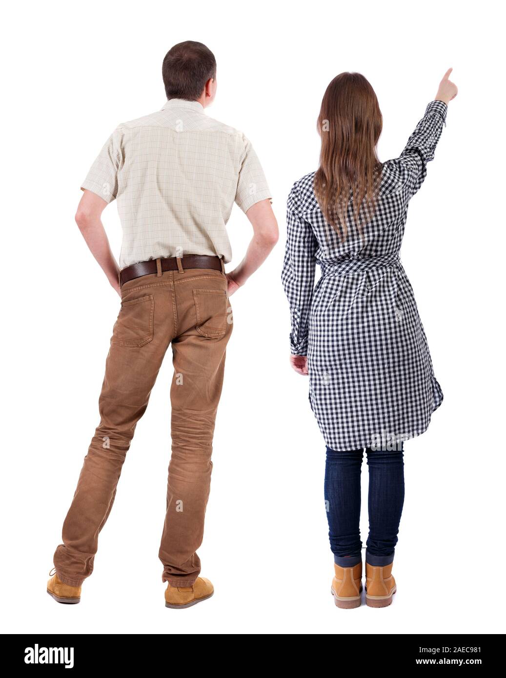Back view of a stylish couple pointing. beautiful friendly girl and guy ...