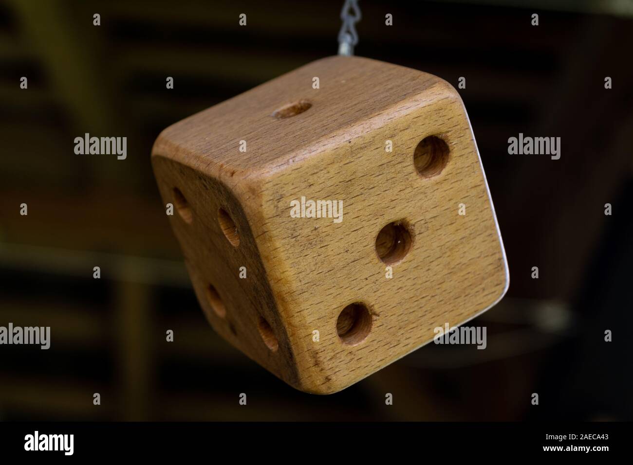 A hanging six side wooden dice Stock Photo - Alamy