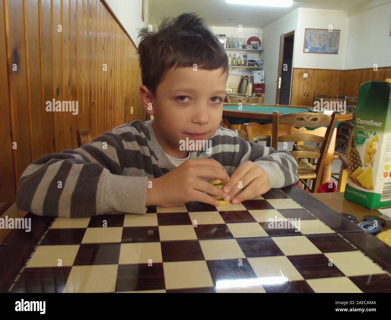 Boy in a traditional greek kafenion Crete, Greece Stock Photo - Alamy