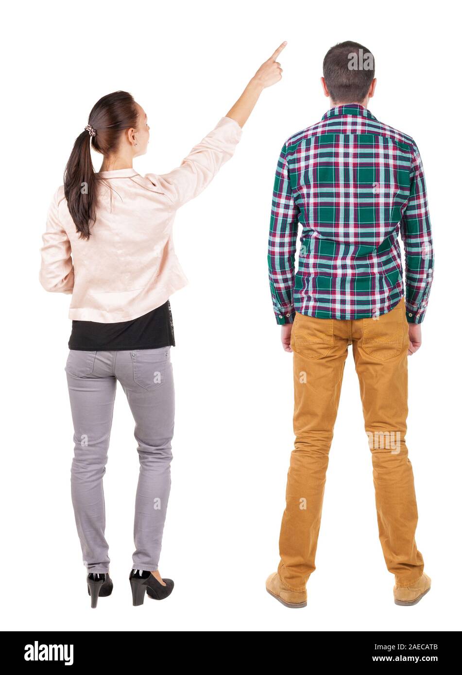 Back view of a stylish couple pointing. beautiful friendly girl and guy ...
