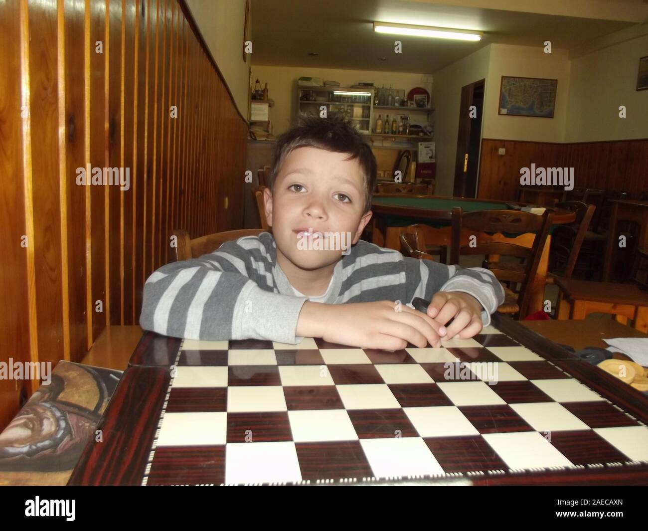 Boy in a traditional greek kafenion Crete, Greece Stock Photo - Alamy
